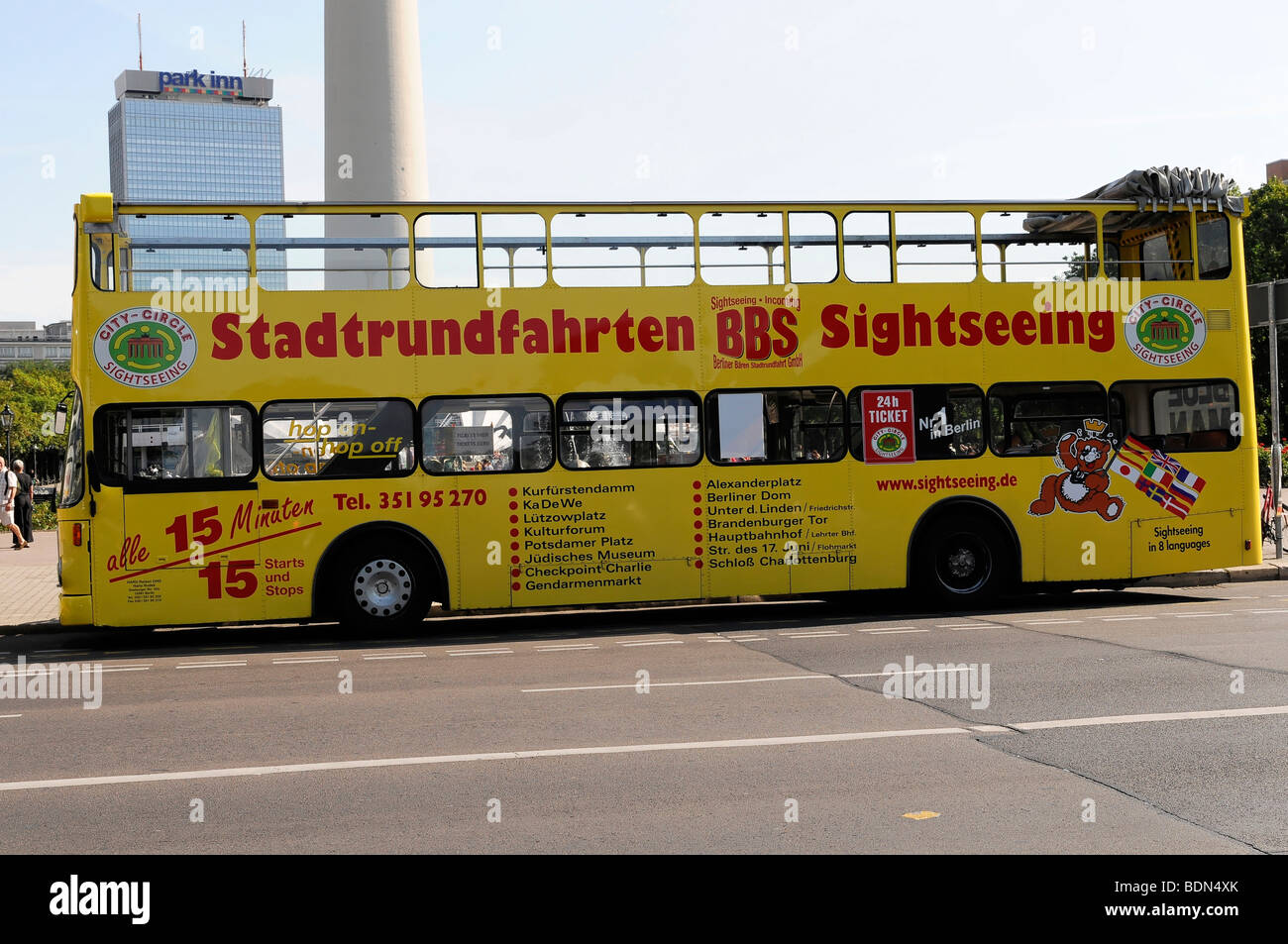 Sightseeing bus driving near the Fernsehturm TV tower, capital Berlin ...