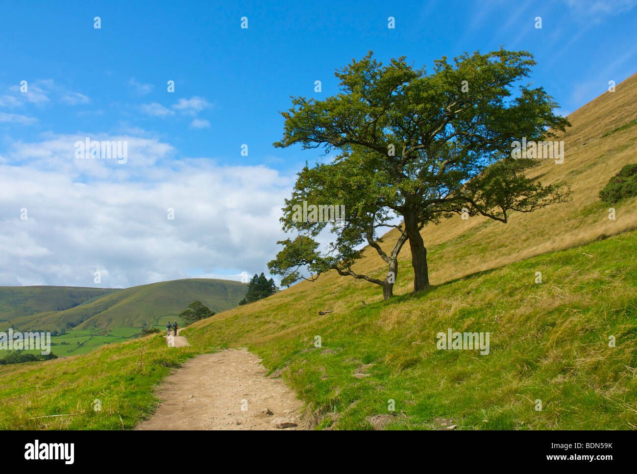 Two walkers on Pennine Way path approaching Upper Booth, near Edale ...