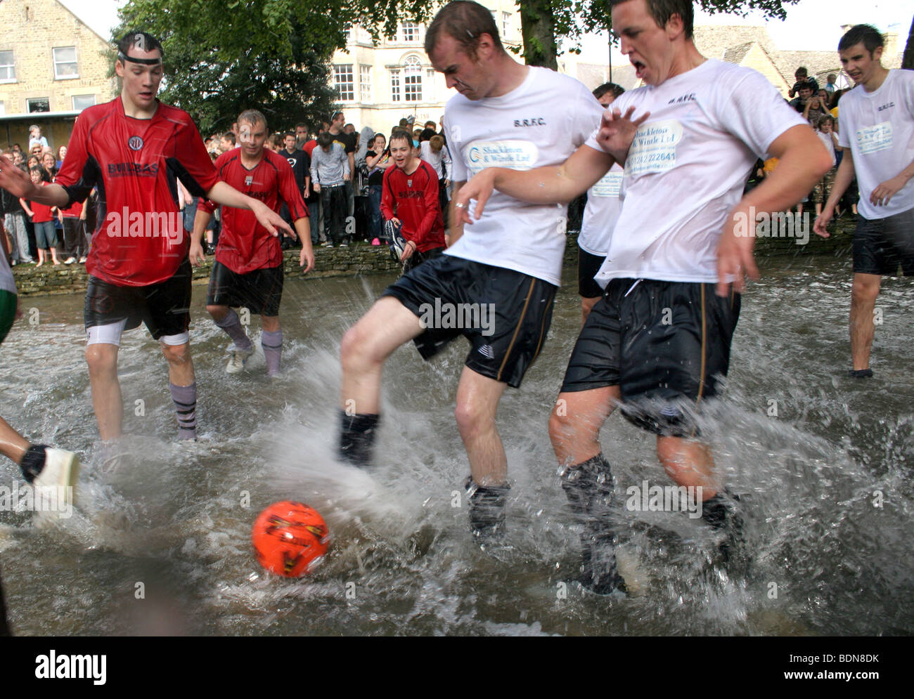 The annual football match held in The River Windrush Bourton on the ...