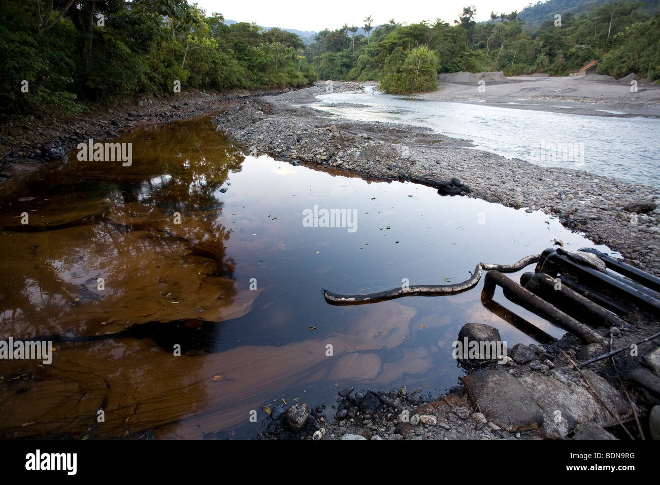 Oil trap at the edge of an Amazonian river, built to retain crude oil ...