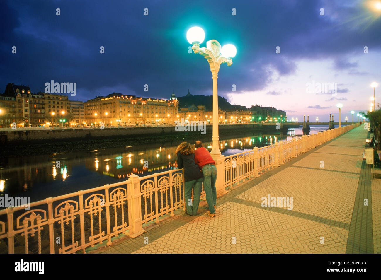 Man standing under street light hi-res stock photography and images - Alamy