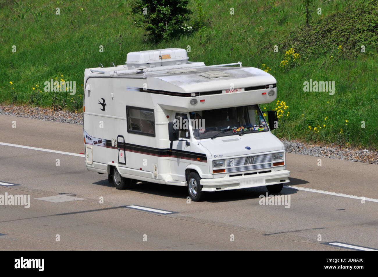 M25 motorway camper van obscured numberplate Stock Photo - Alamy