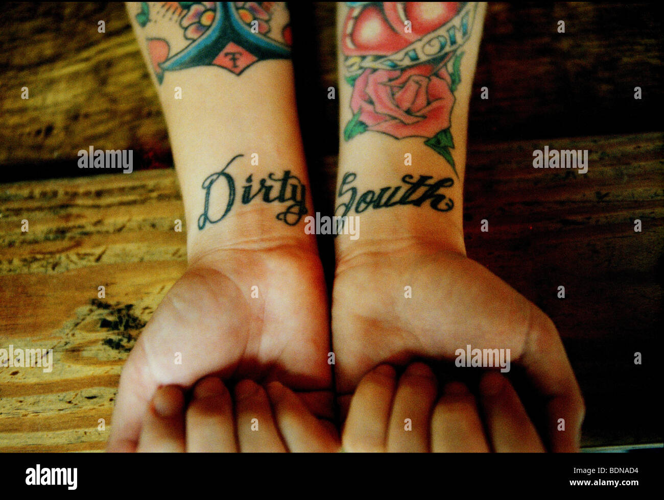 A tattoo on two arms Stock Photo - Alamy