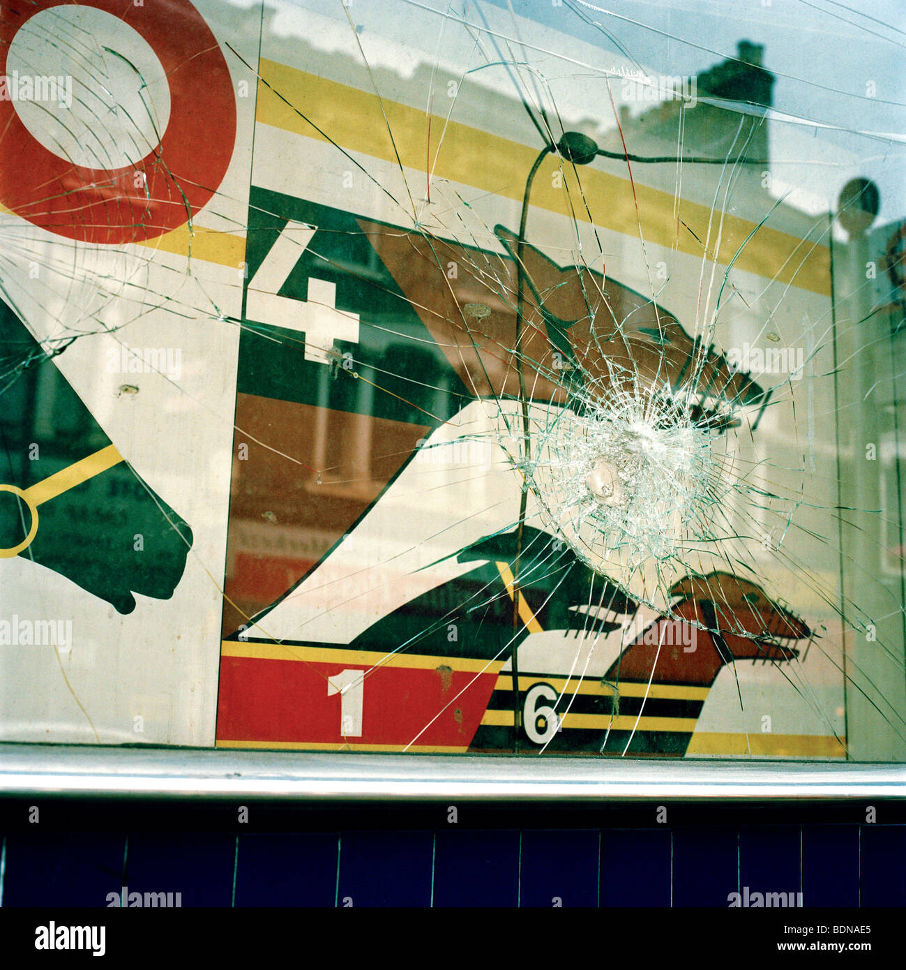 Broken window of a bookmakers in Newington Green, London Stock Photo ...