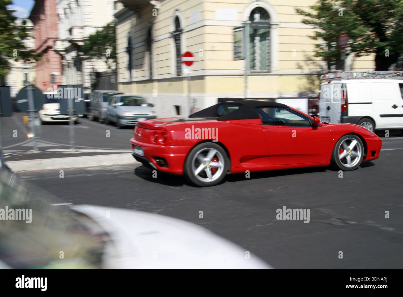 red ferrari sports car in street in rome, italy Stock Photo - Alamy