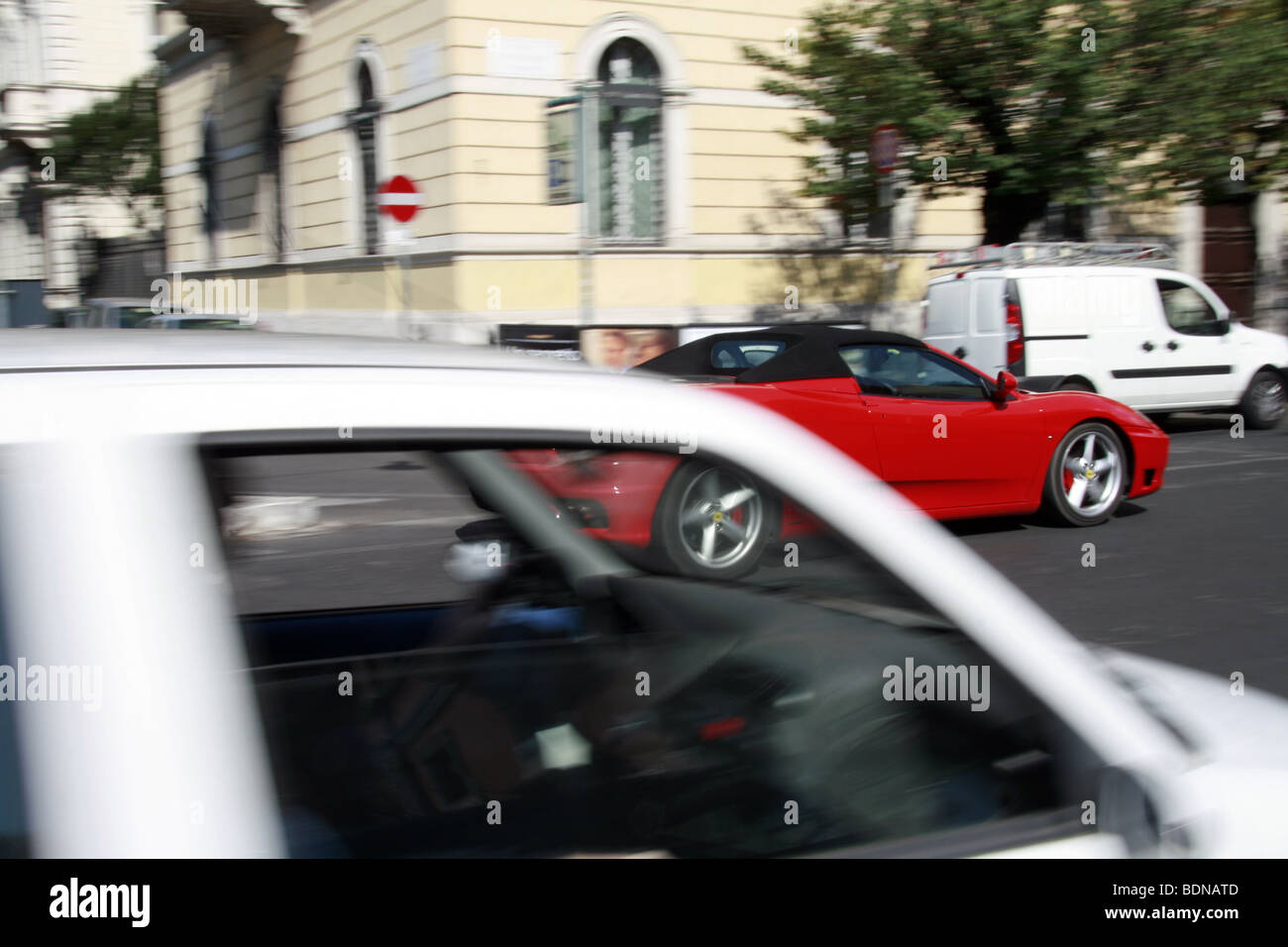 red ferrari sports car in street in rome, italy Stock Photo - Alamy
