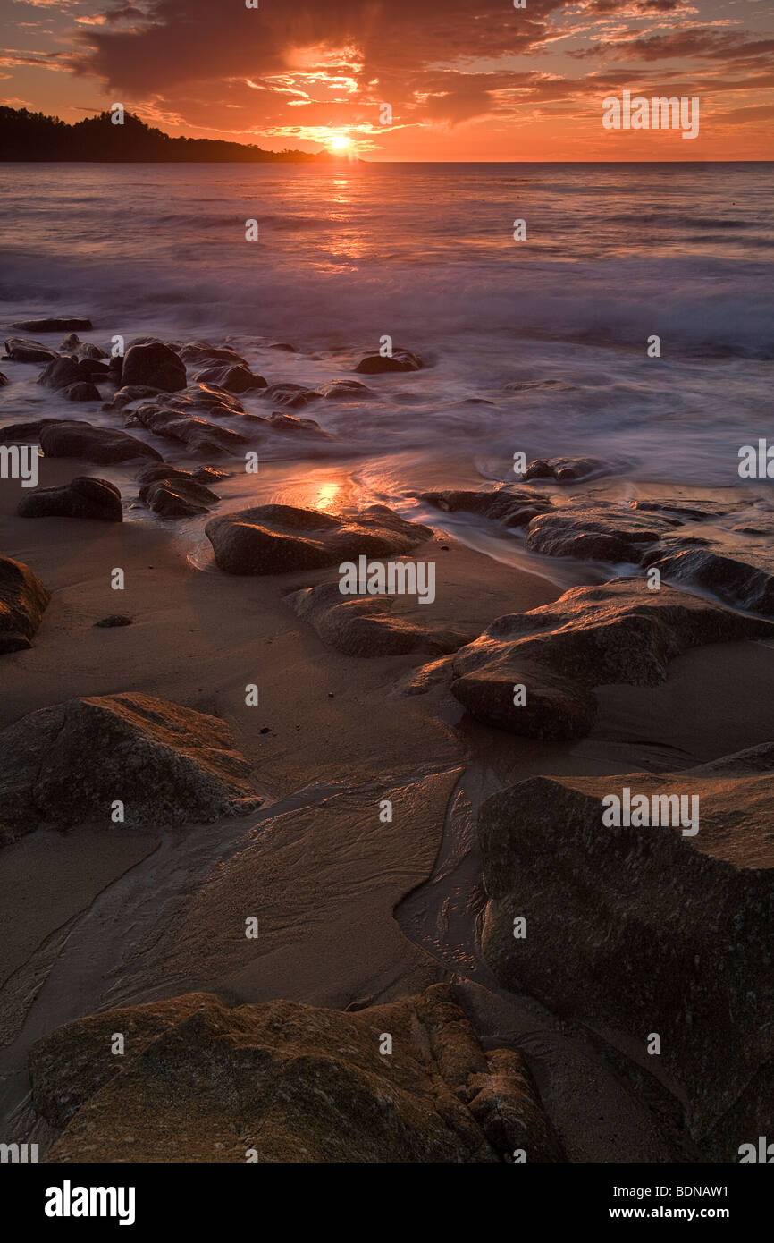 Tiny streams feed water to the Pacific Ocean at sunset, near Pt. Lobos ...