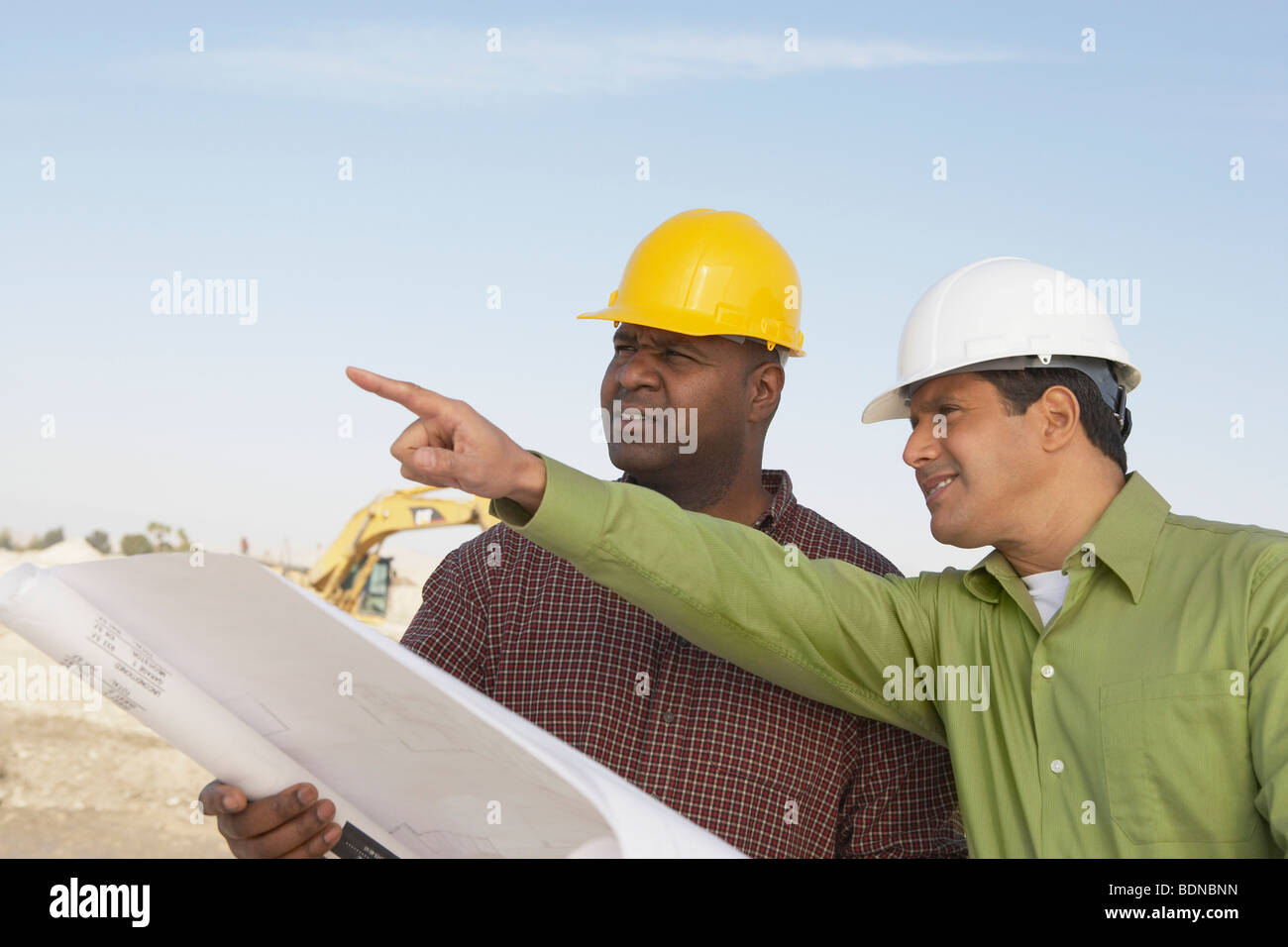 Construction Workers Reading Blueprints Stock Photo - Alamy