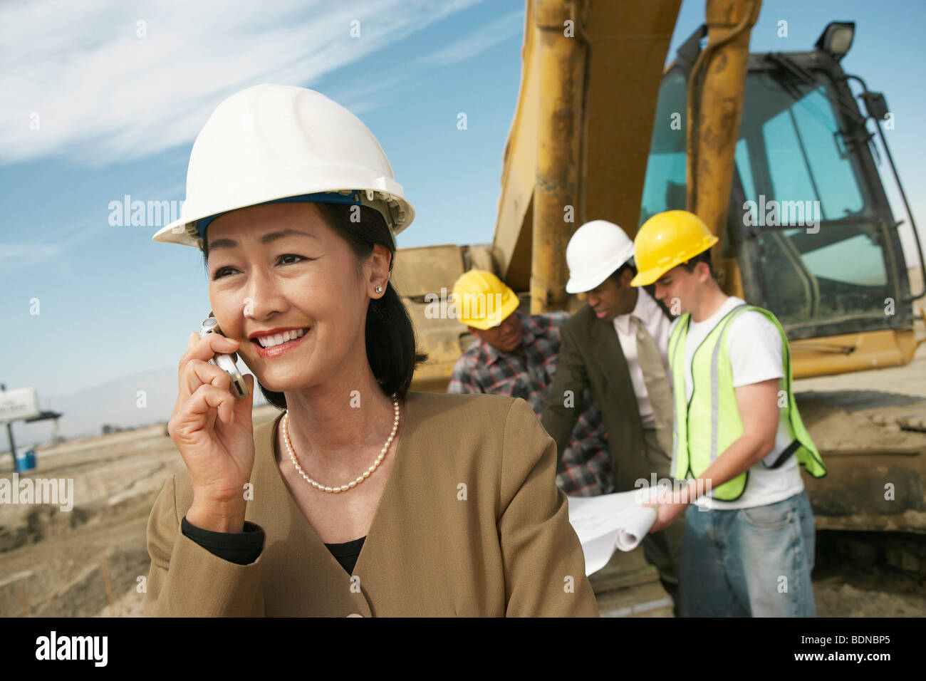 Surveyor Using Cell Phone Stock Photo - Alamy