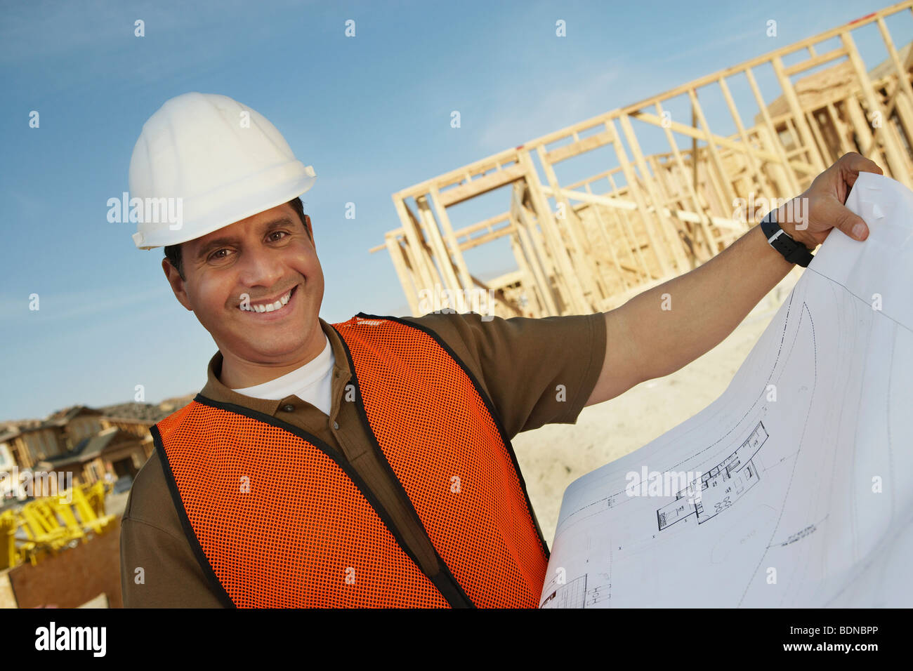 Construction Worker Reading Blueprints Stock Photo - Alamy