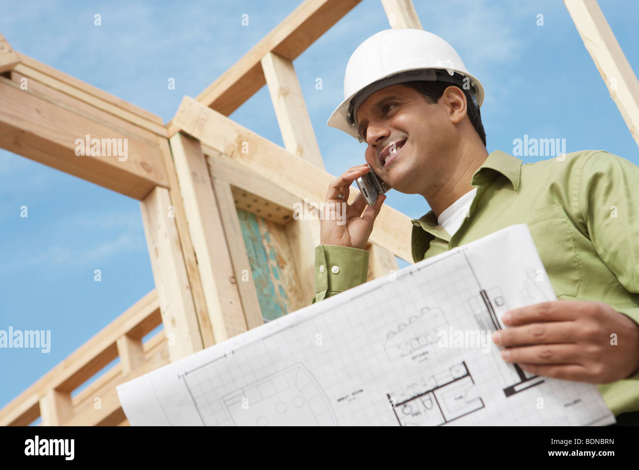 Construction Worker Using Cell Phone Stock Photo - Alamy