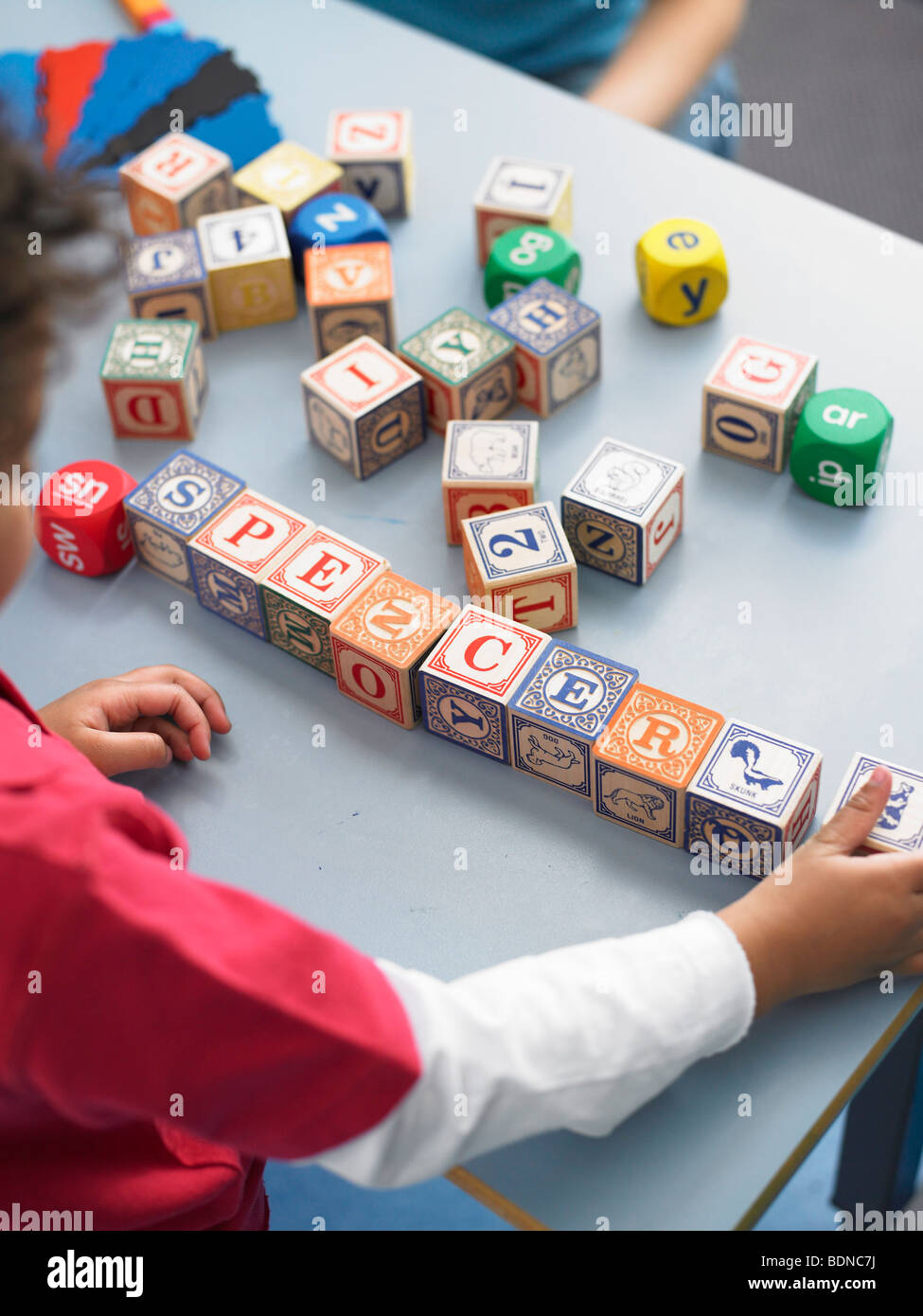 Boy Playing with Alphabet Blocks Stock Photo - Alamy