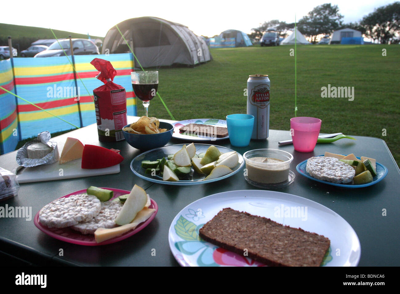 Camping table laden with food Stock Photo - Alamy