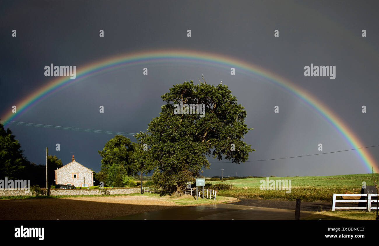 Stunning summer rainbow over farm buildings and cottage Stock Photo - Alamy