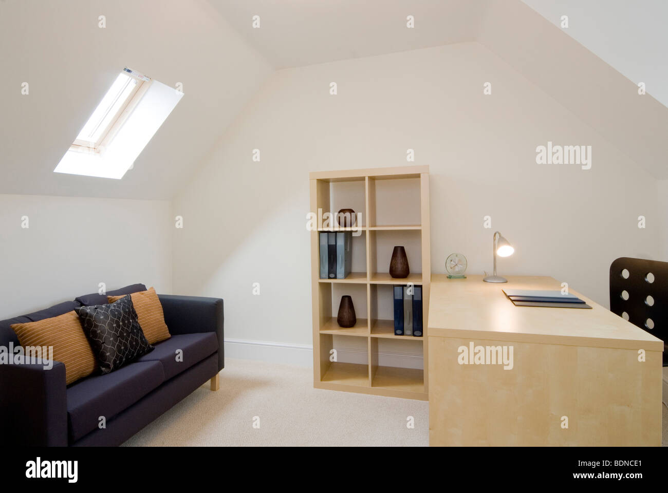 Clean and tidy study area in converted loft space in a modern house ...