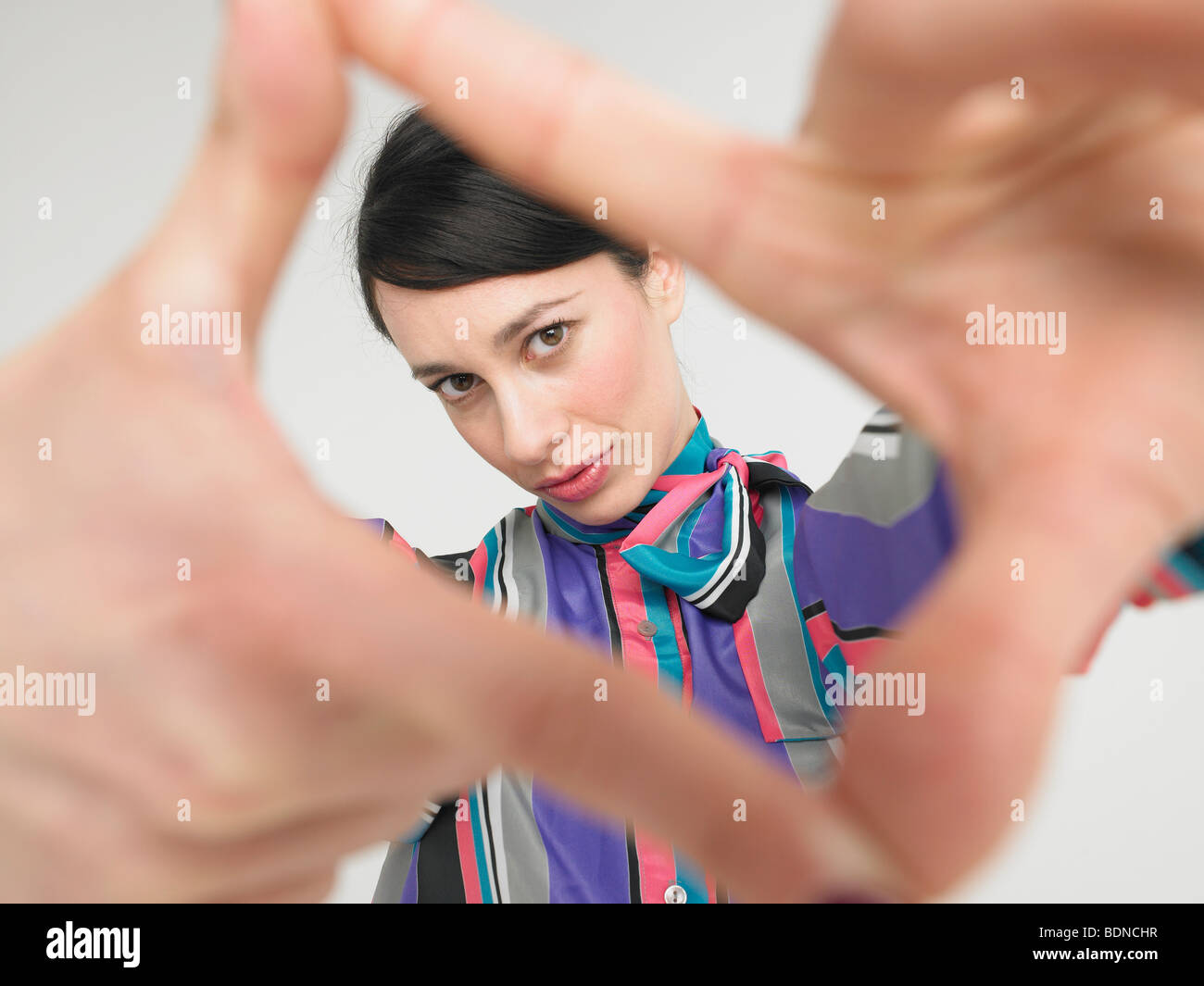 Young Businesswoman Making Finger Frame Stock Photo - Alamy