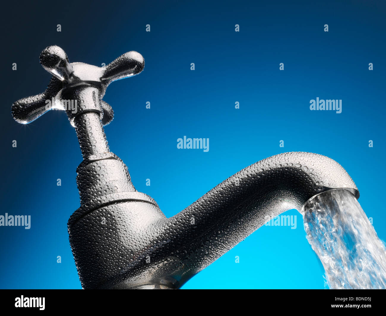 Water pouring from tap, close-up Stock Photo - Alamy