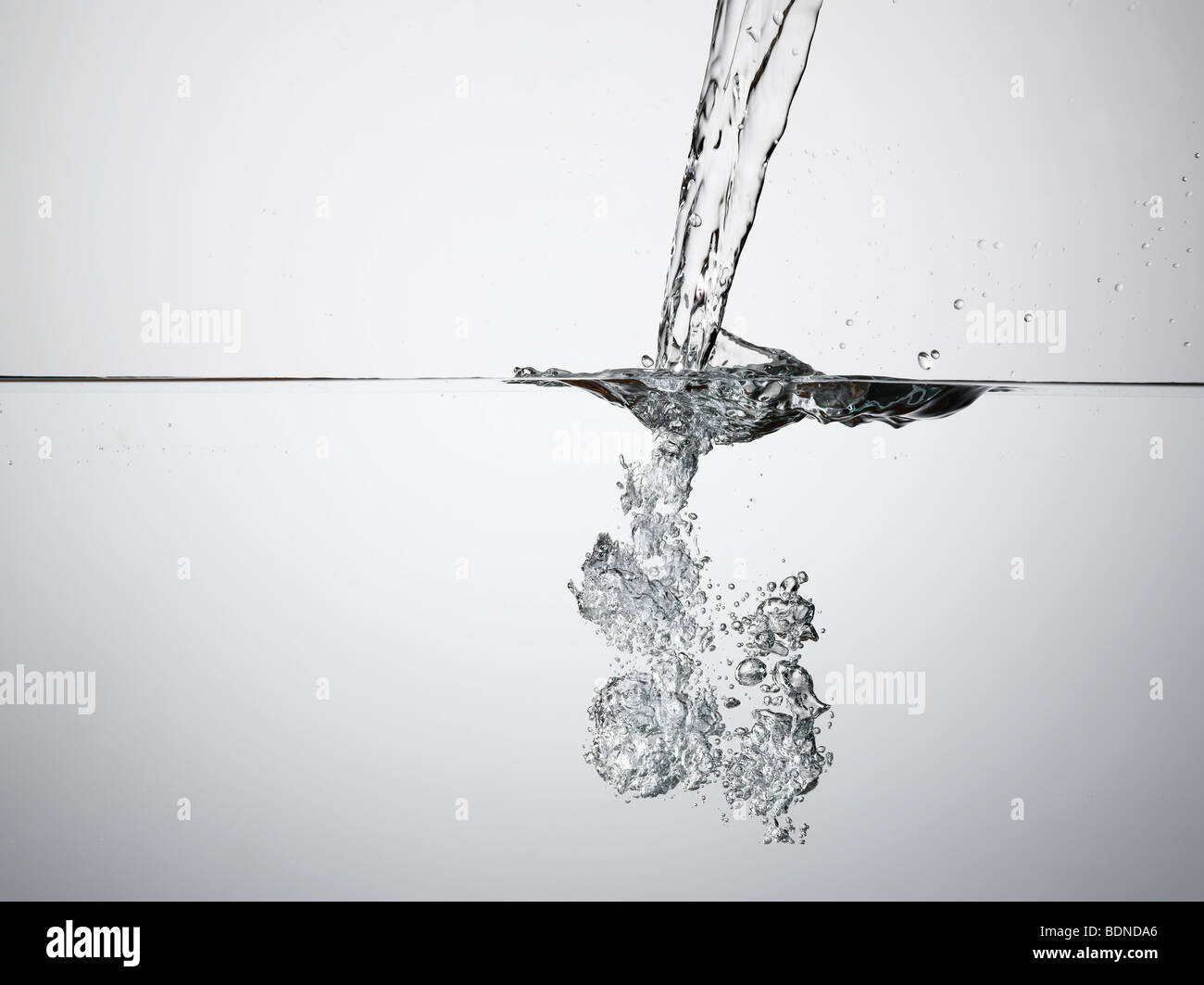 Jet splashing into water, surface view Stock Photo - Alamy