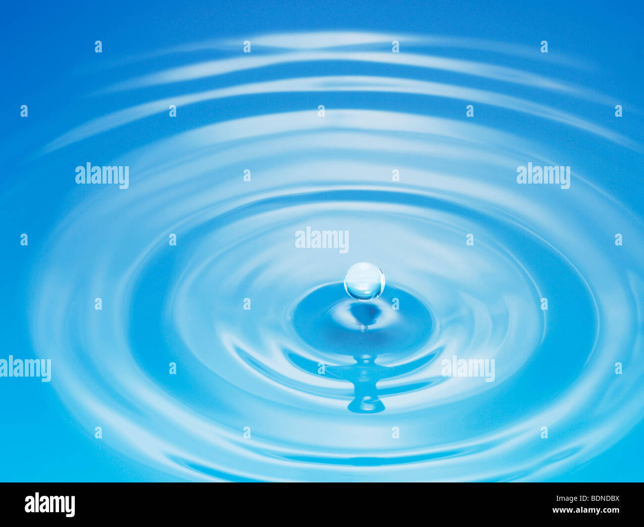 Drop hitting surface of water, close-up Stock Photo - Alamy
