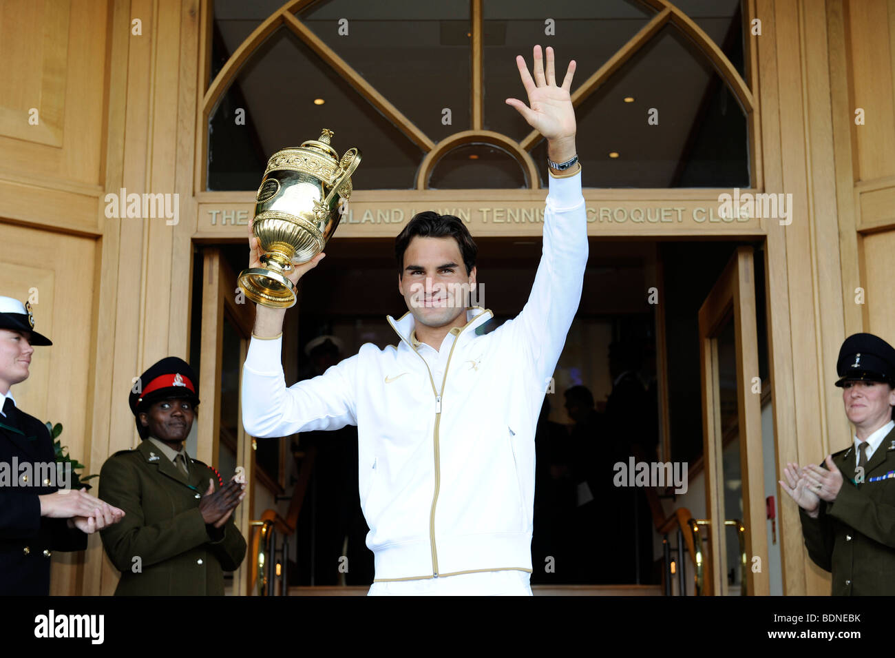 Roger Federer celebrates with the trophy after winning the 2009 ...