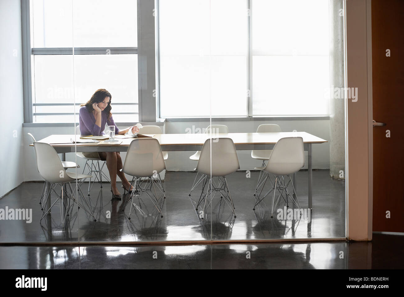 Business woman sitting in conference room Stock Photo - Alamy