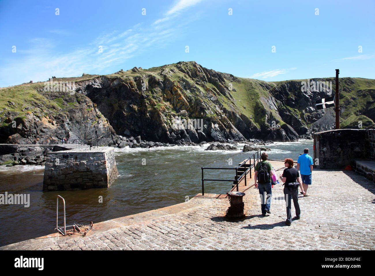 England Cornwall Mullion Cove People walking along the side of the ...