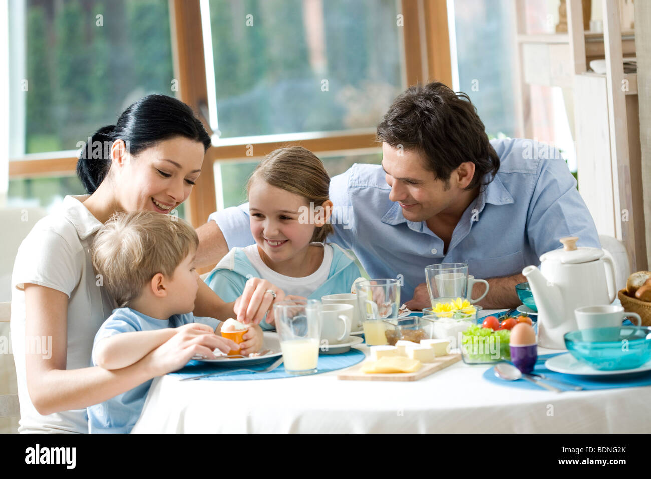 Dining eating father mother kids children boy girl hi-res stock ...