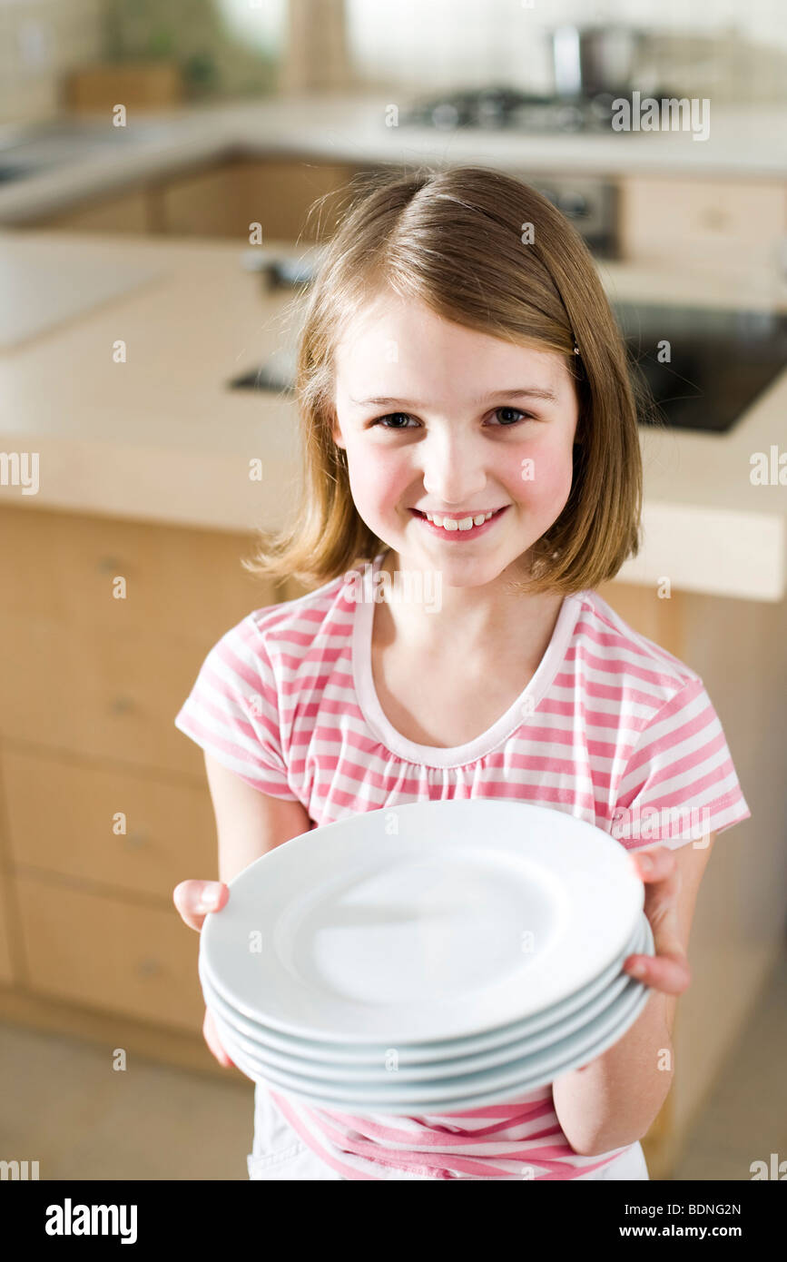 Girl laying the table Stock Photo - Alamy