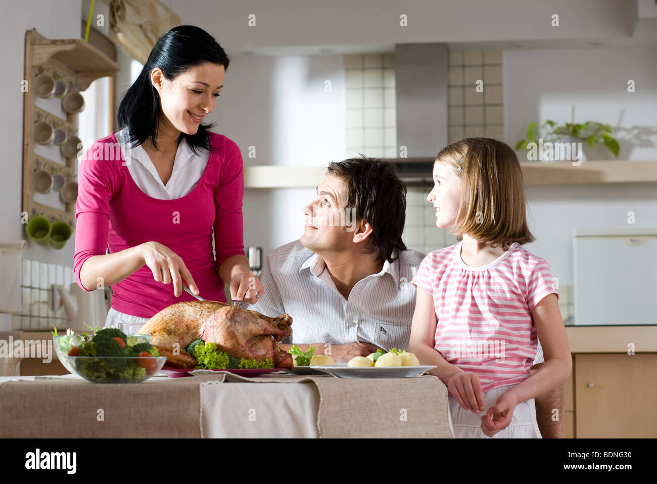 Family eating dinner Stock Photo - Alamy