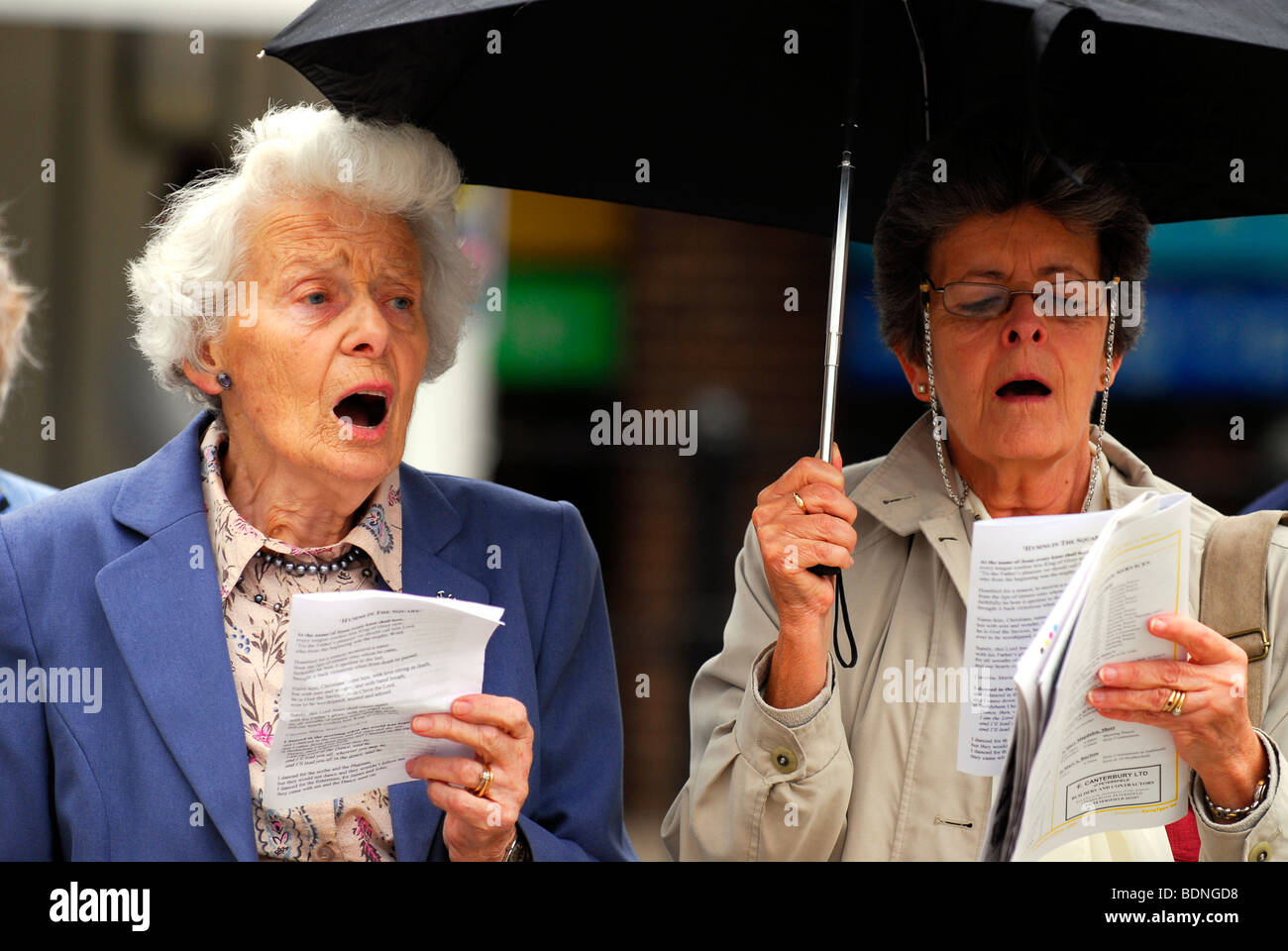 Old women singing hi-res stock photography and images - Alamy