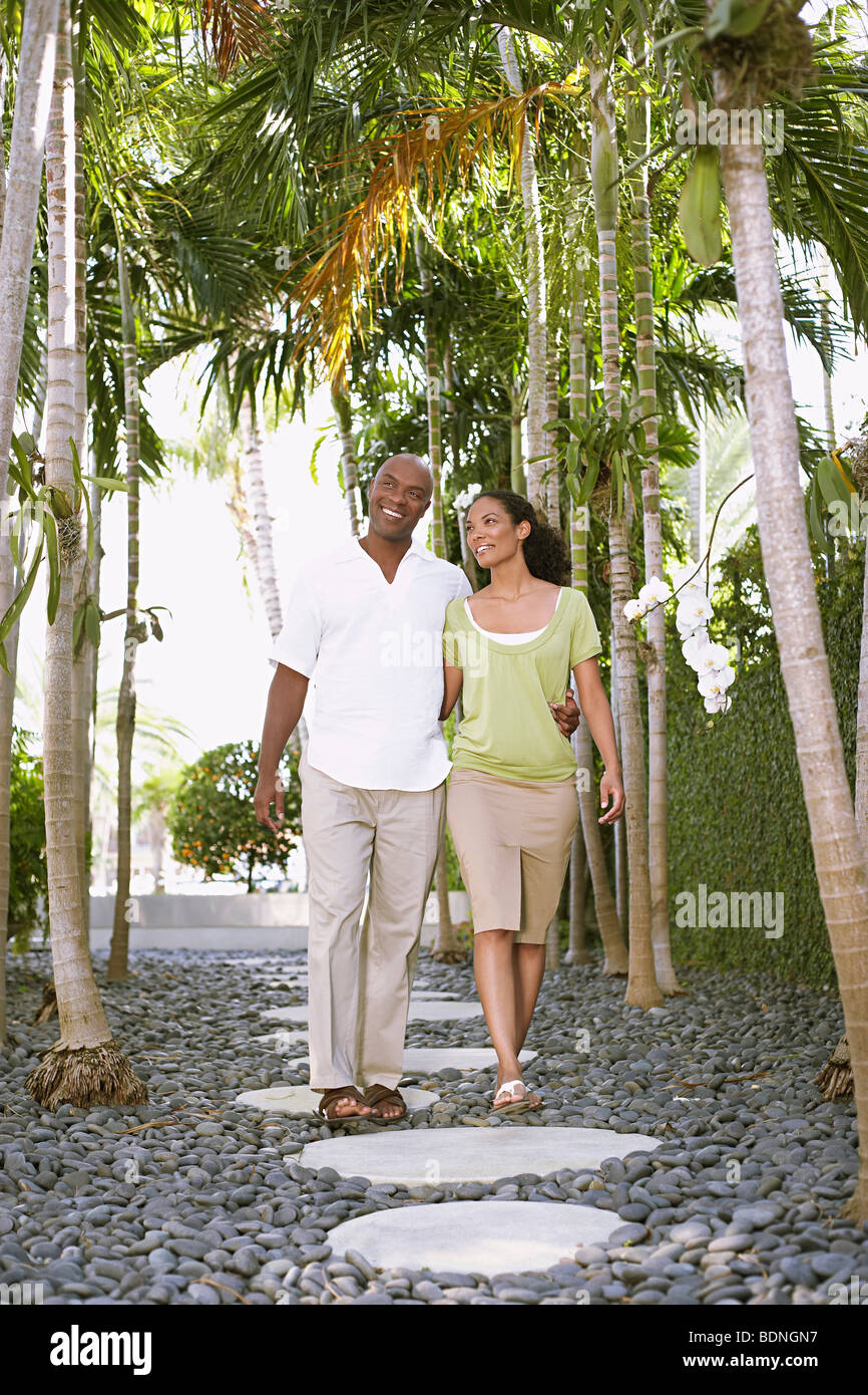 Couple walking on path Stock Photo - Alamy