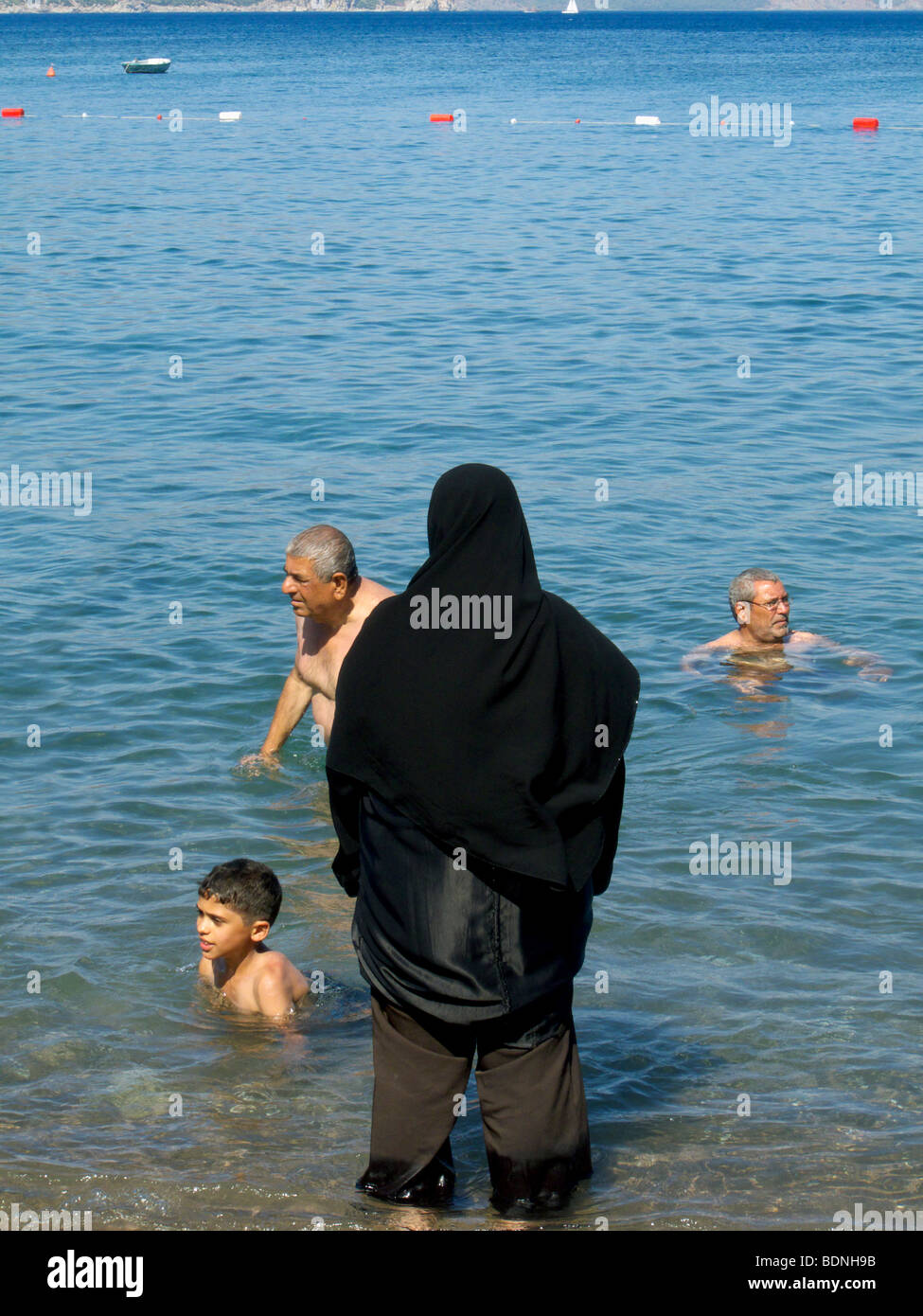 Bathing fully clothed hi-res stock photography and images - Alamy