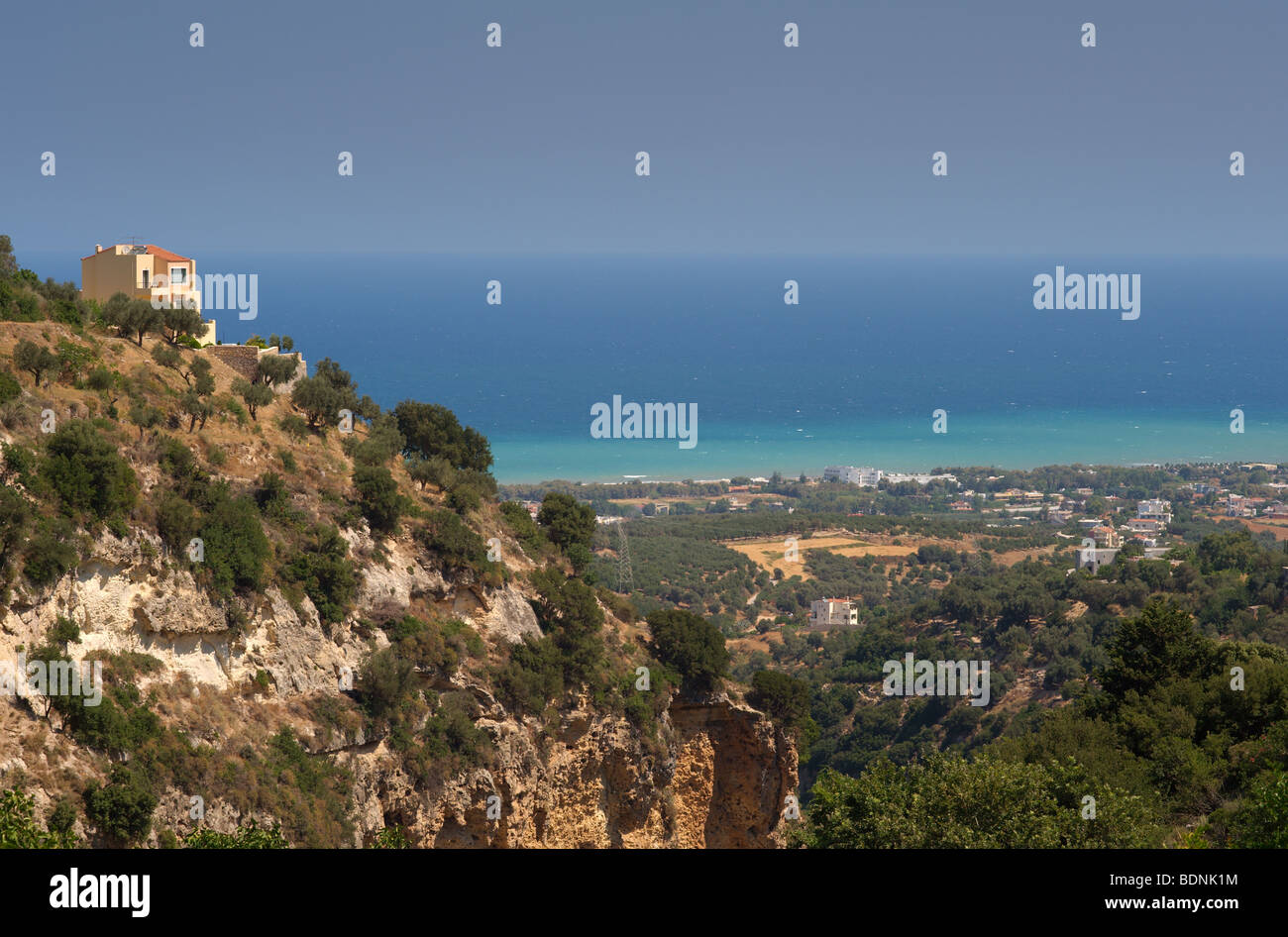 Hilltop modern property overlooking the blue Cretan sea Stock Photo - Alamy
