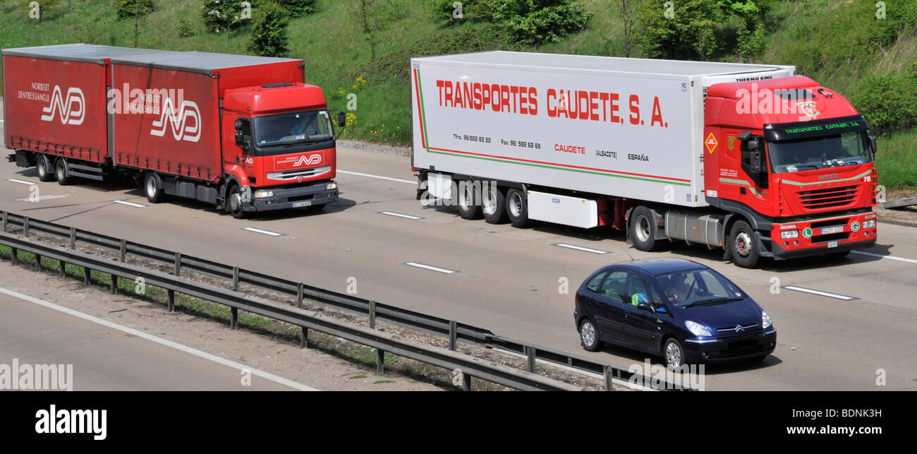 Side and front views of lorry trucks and trailers driving on English UK ...