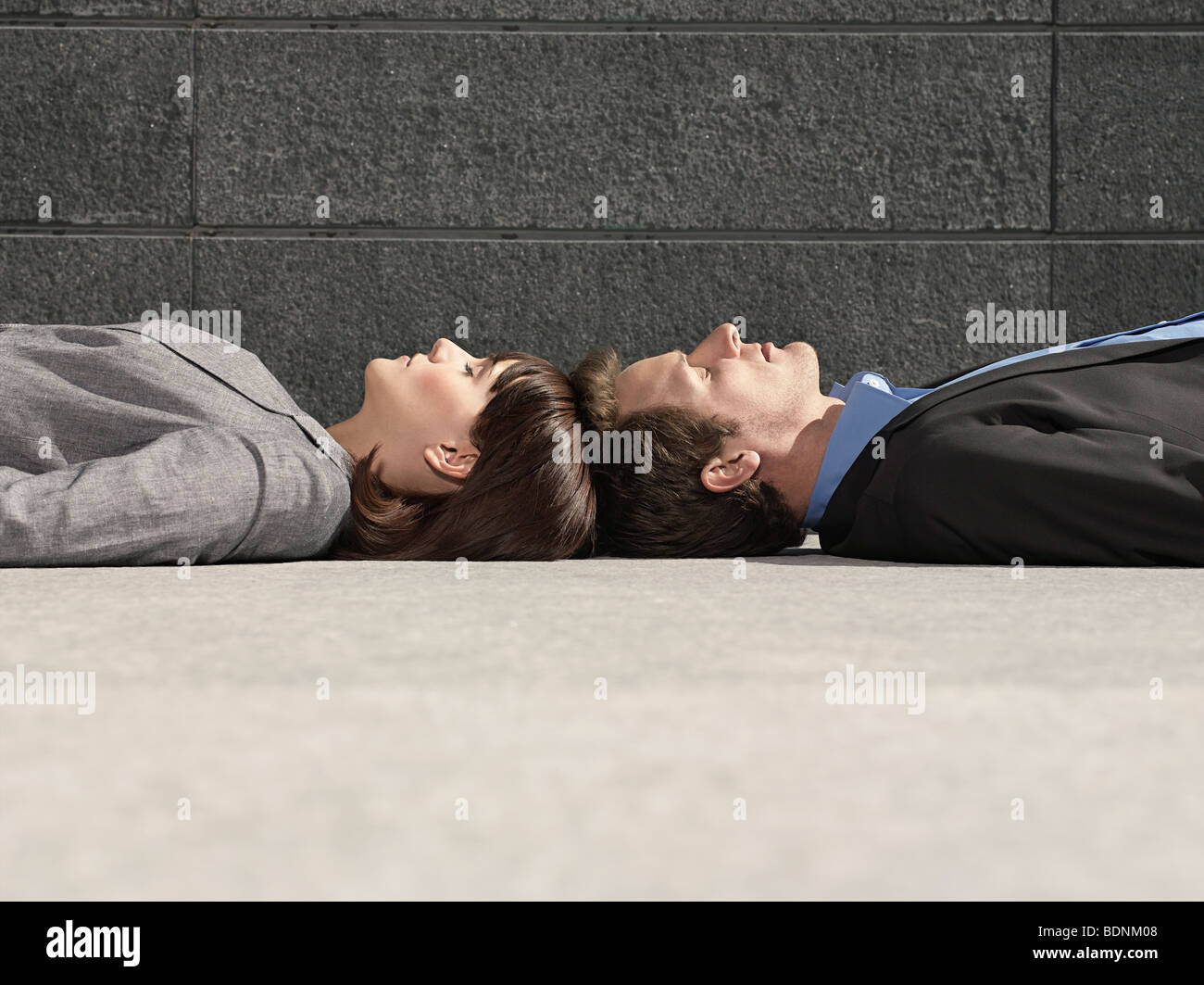 Woman lying on the ground side view hi-res stock photography and images ...