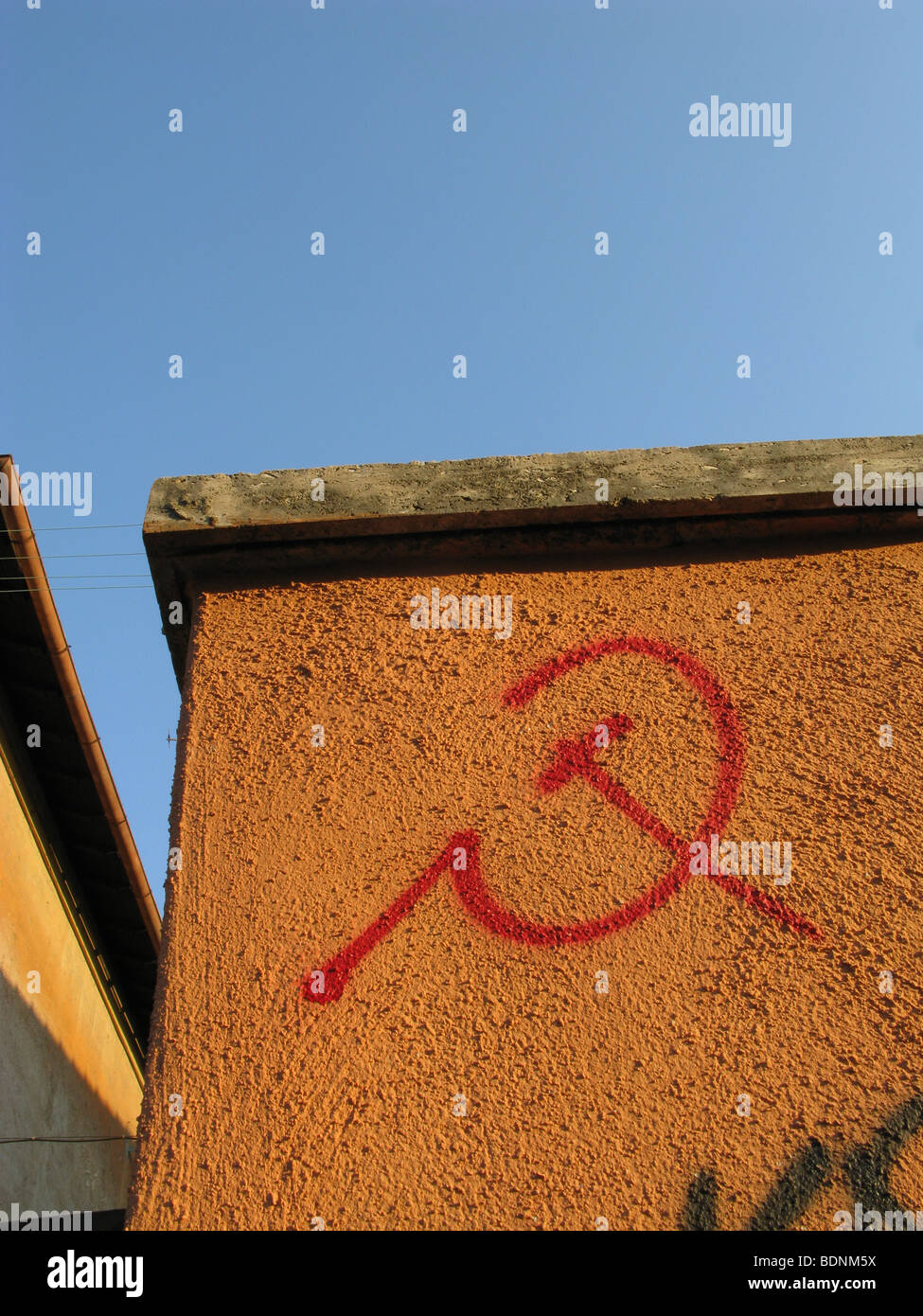 communist symbol written on wall in garbatella, rome Stock Photo - Alamy