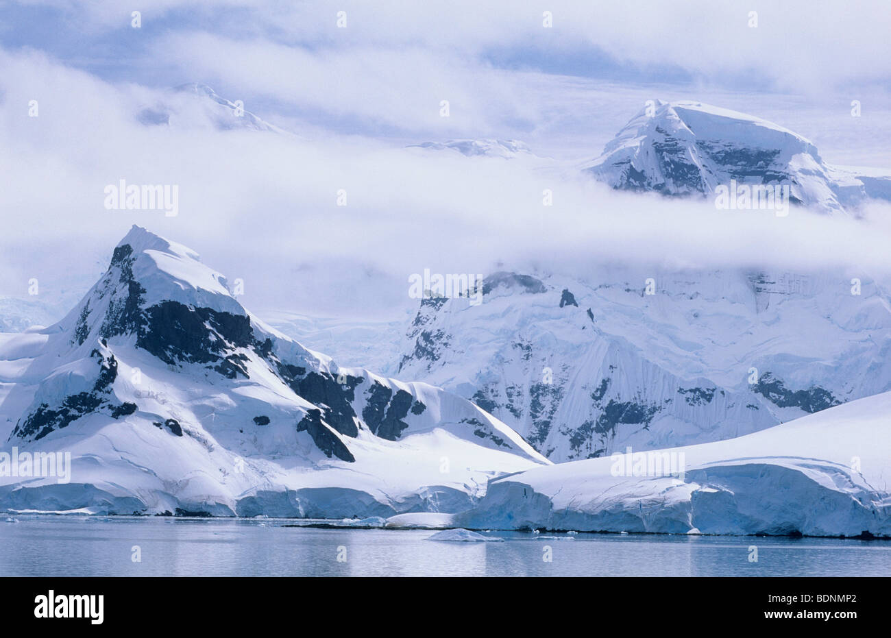 Antarctica, Snow covered mountains and icebergs Stock Photo - Alamy