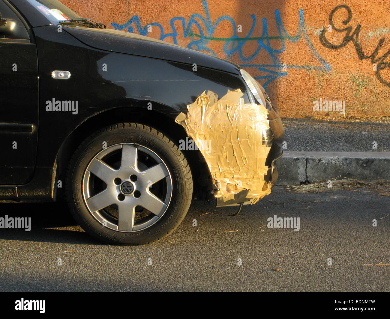 car with adhesive tape repair on front wing Stock Photo - Alamy