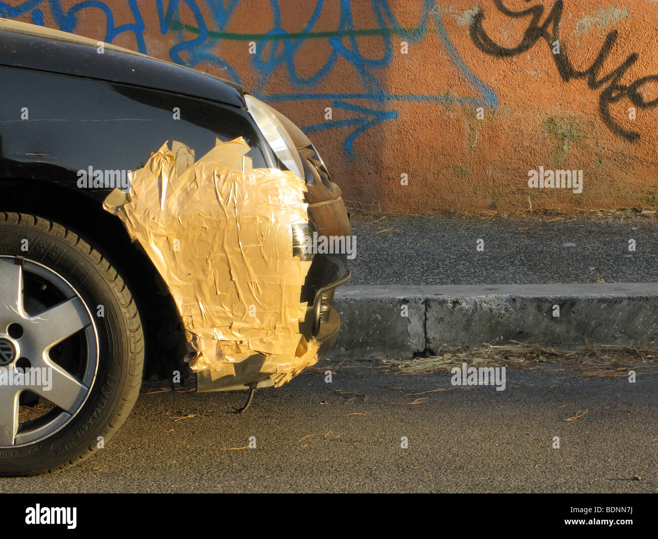 car with adhesive tape repair on front wing Stock Photo - Alamy