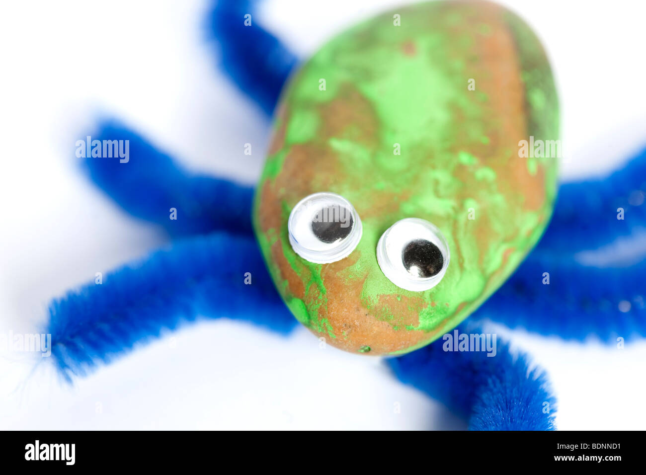 Toy bug made from a stone Stock Photo - Alamy