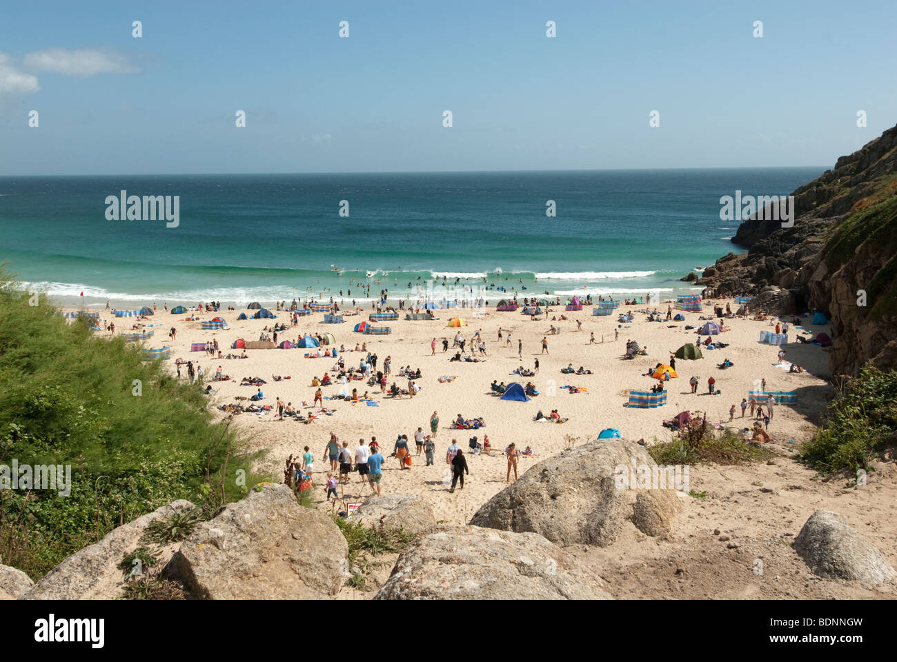 Cornish seaside beach full of people in summer Porthcurno Stock Photo ...