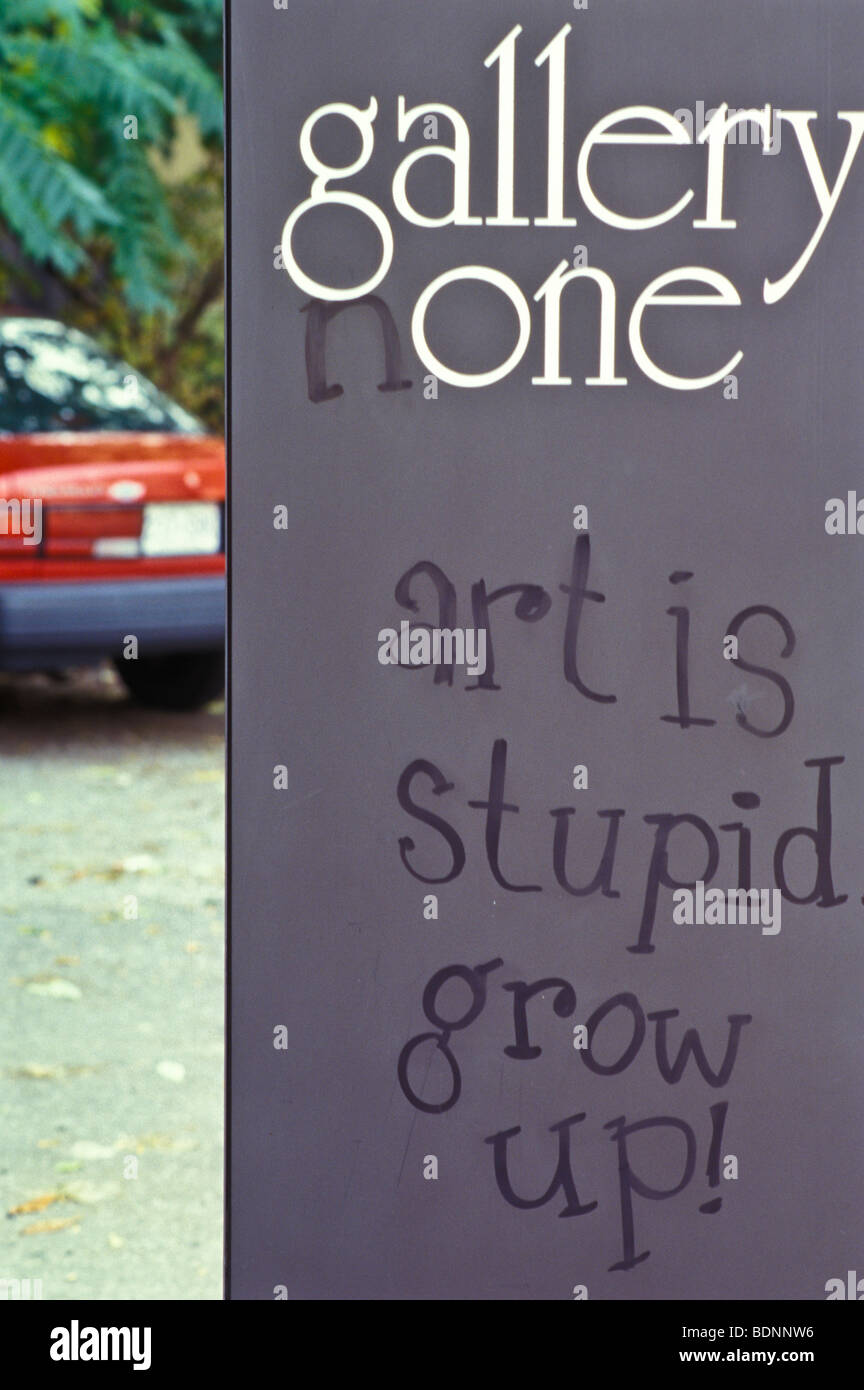 Gallery none one art is stupid grow up graffiti on sign Stock Photo - Alamy