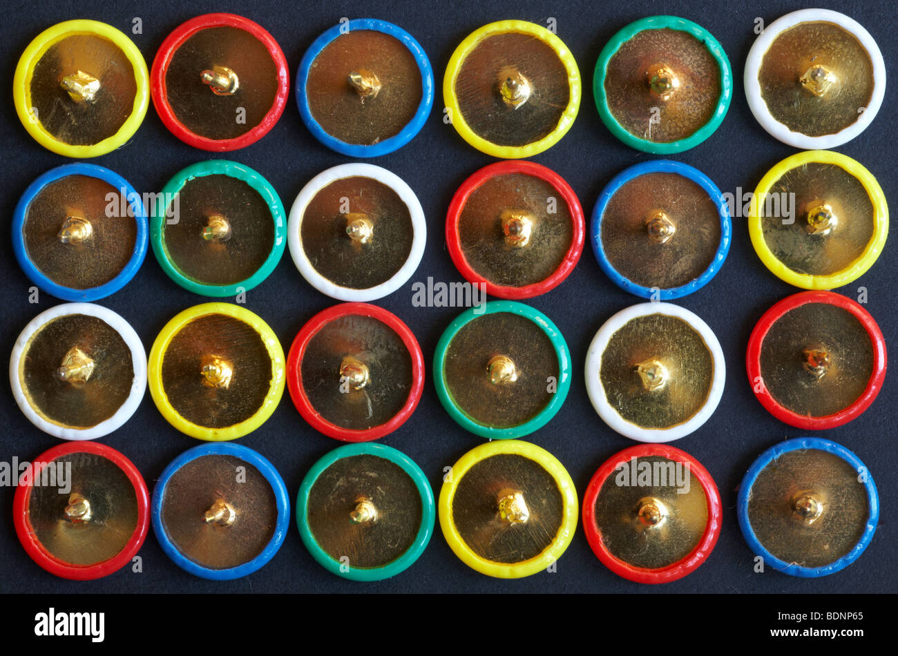 Drawing pins pattern, rows of colourful drawing pins in a square close ...