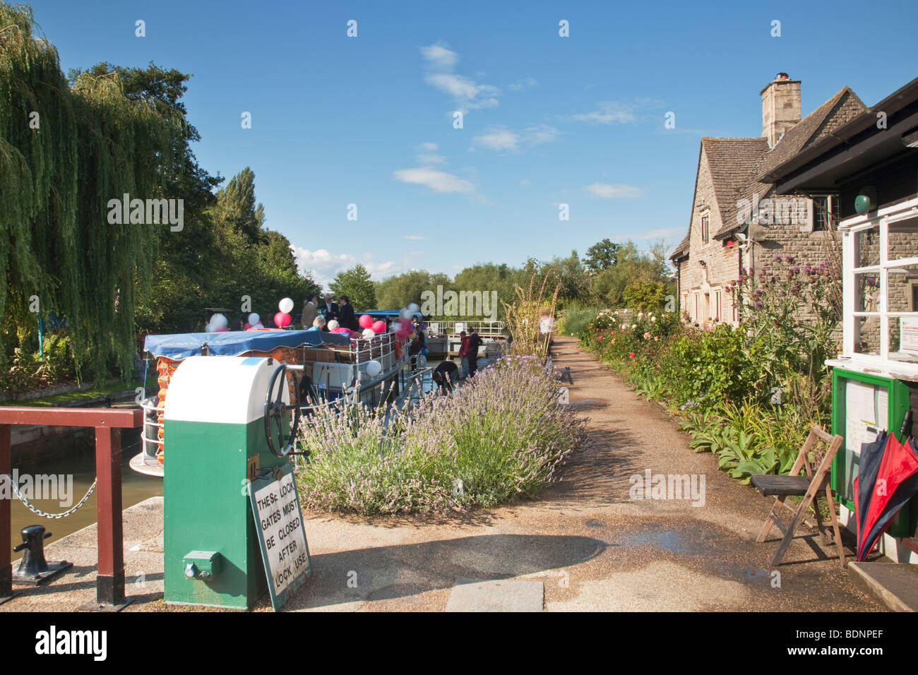 Party barge at Iffley Lock on the River Thames at Oxford, Oxfordshire ...