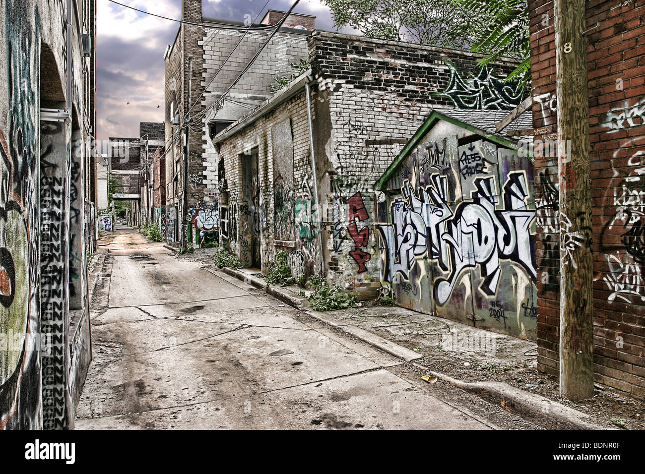 A back alley with graffiti Stock Photo - Alamy