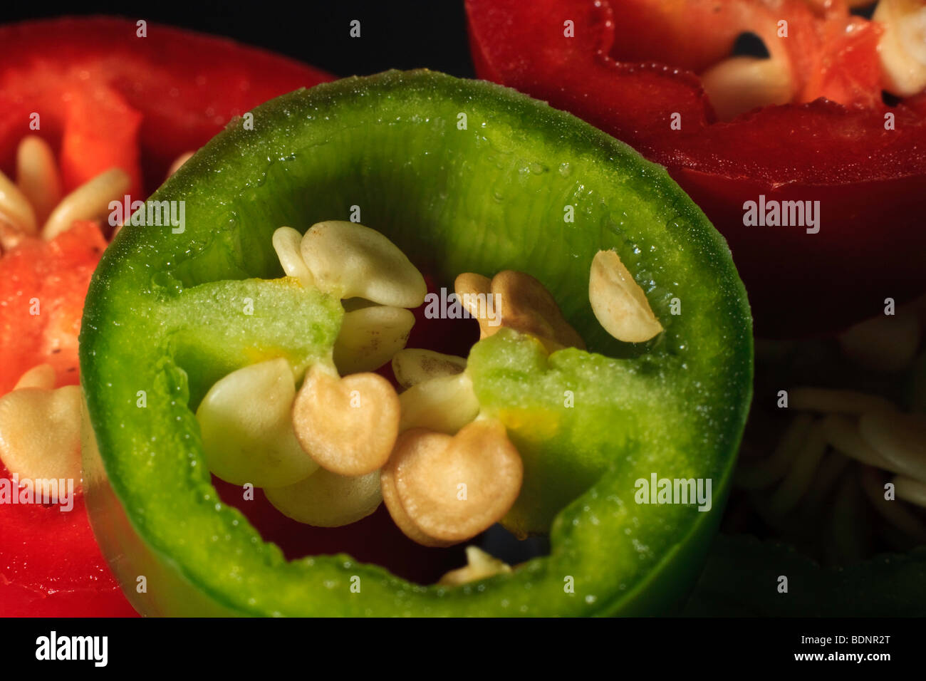 Sliced green and red chilli's close up Stock Photo - Alamy