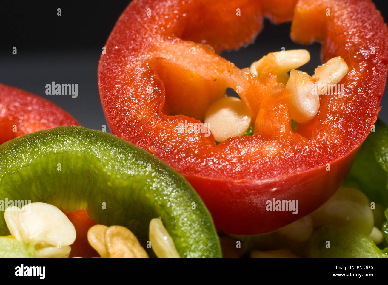 Sliced red and green chilli's close up Stock Photo - Alamy