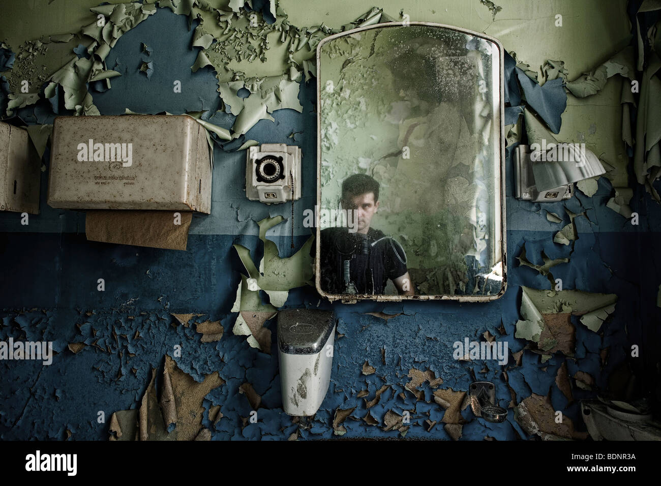 The reflection of a man in an old mirror Stock Photo - Alamy