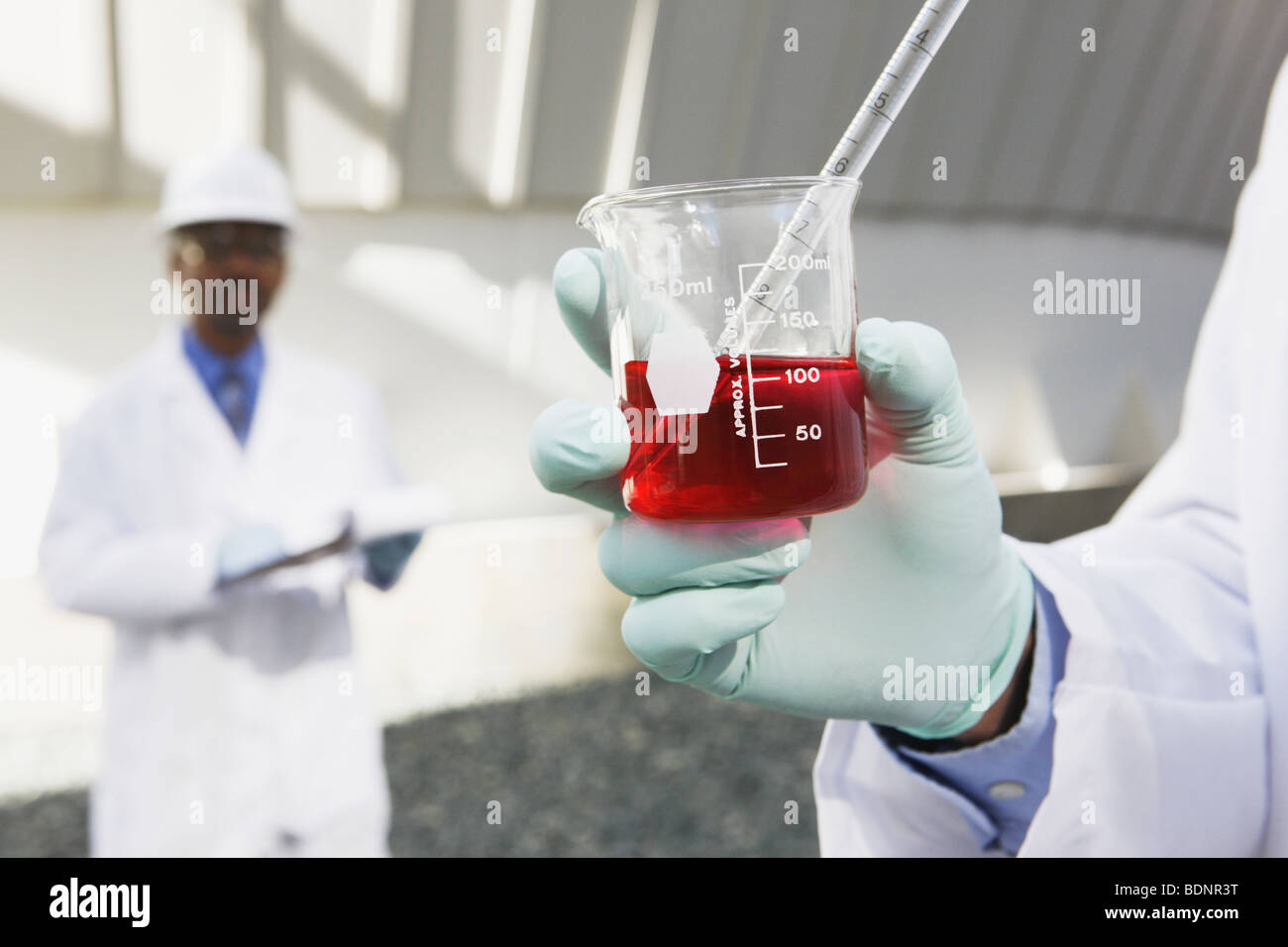 Scientist experimenting with a water sample Stock Photo - Alamy
