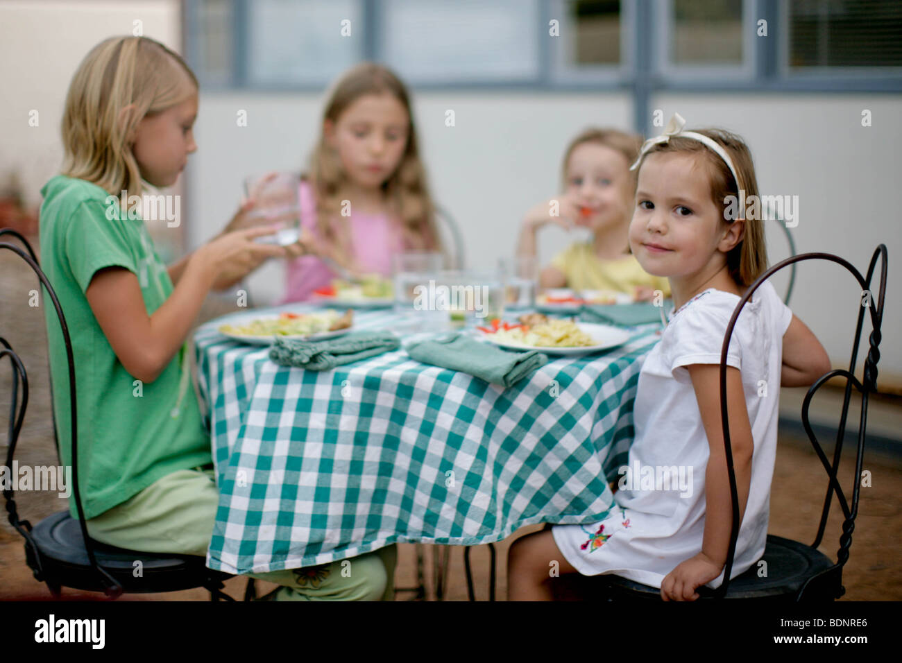 Girls having lunch outdoors Stock Photo - Alamy